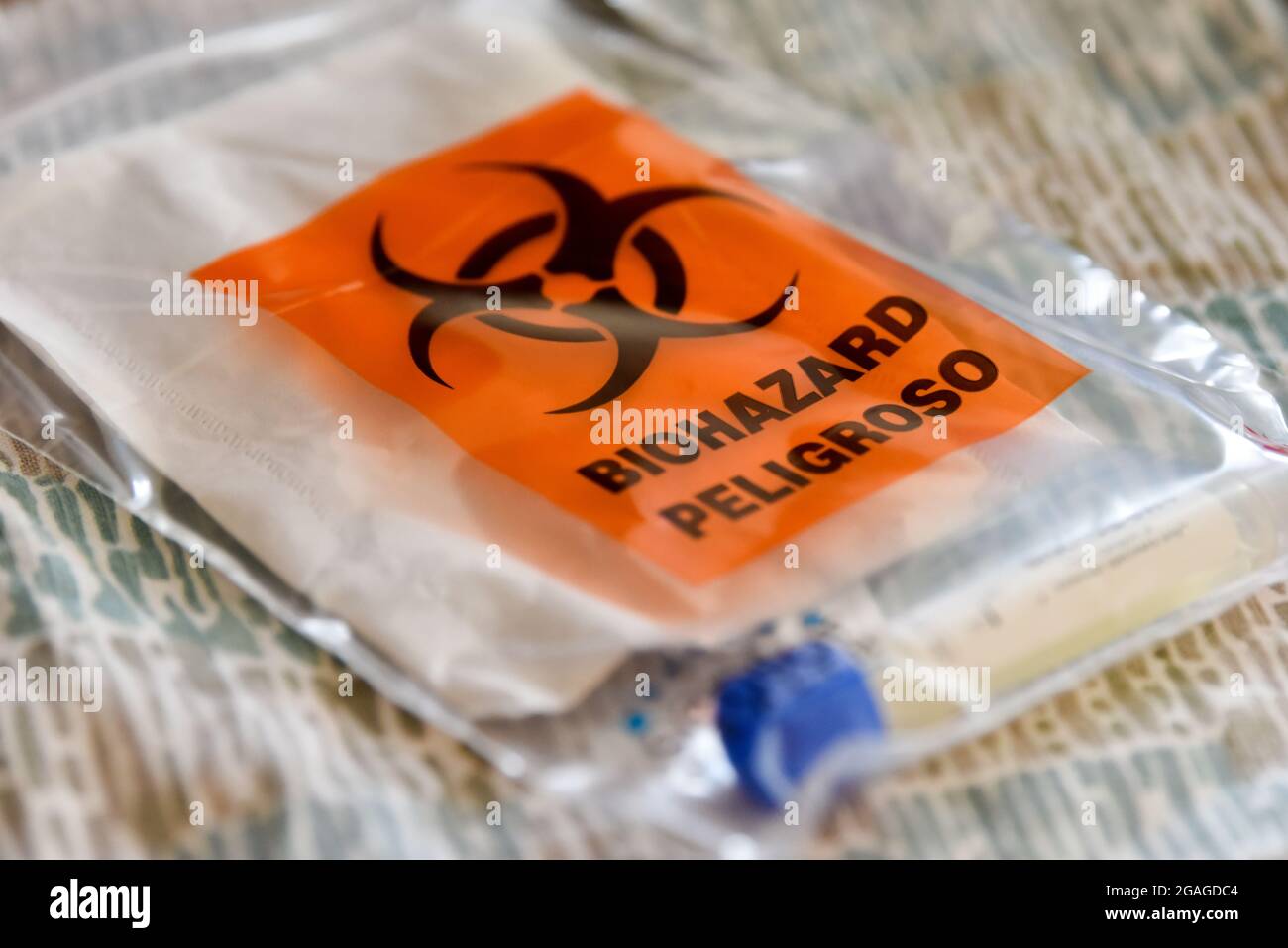 Covid-19 home self-test kit sample in biohazard bag ready to be shipped ...