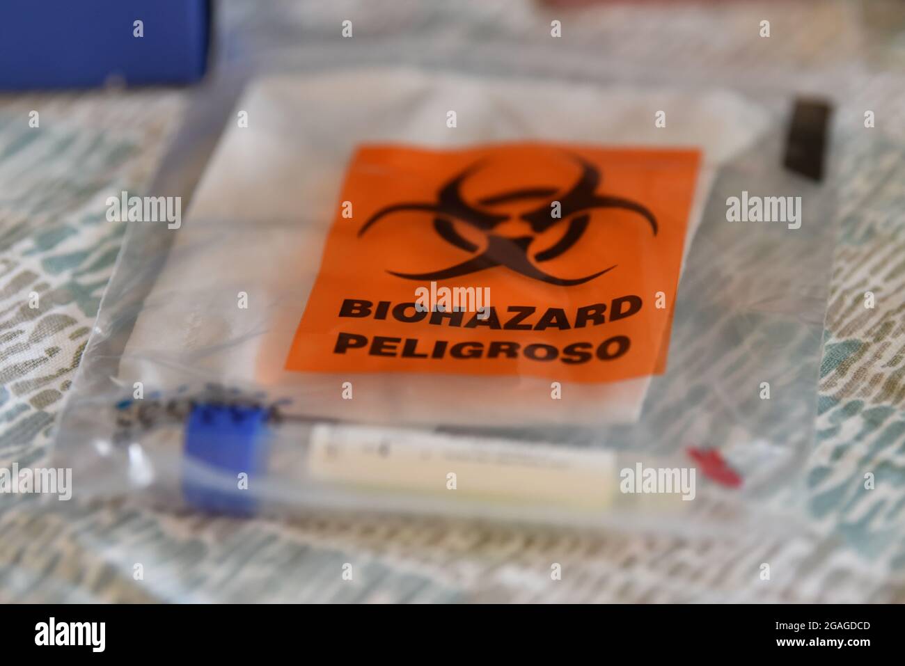 Covid-19 home self-test kit sample in biohazard bag ready to be shipped ...