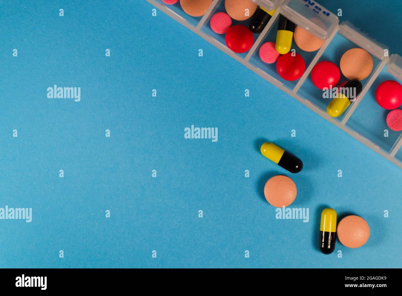 Prescription Drug Sorting Container On Blue Surface Stock Photo - Alamy
