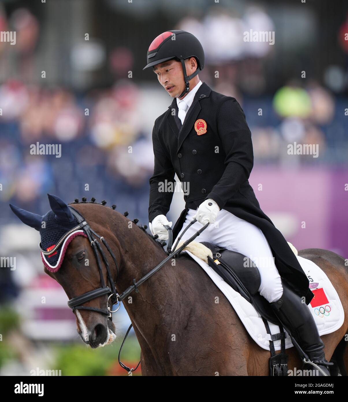 Tokyo, Japan. 31st July, 2021. Bao Yingfeng of China and his horse ...