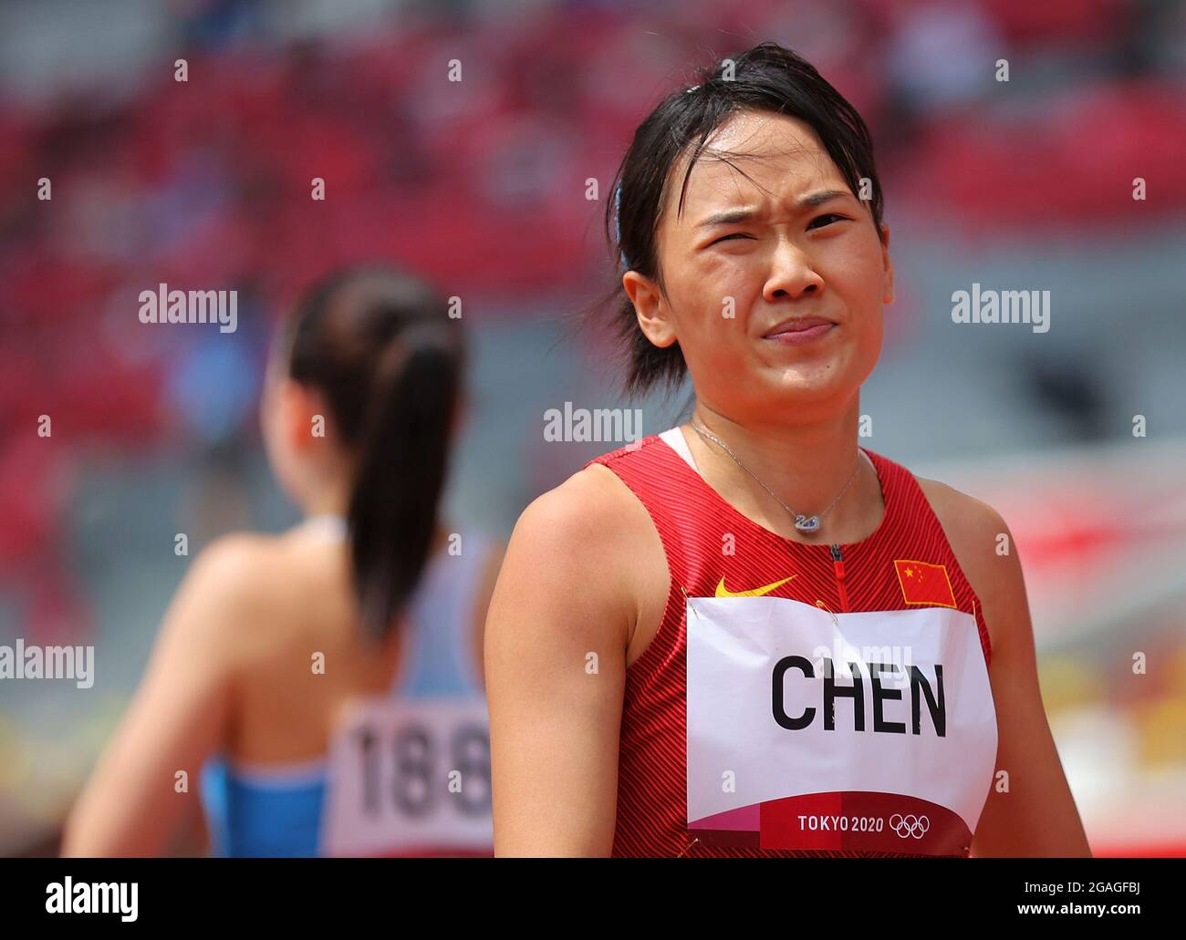 Tokyo, Japan. 31st July, 2021. Chen Jiamin of China reacts during the women's 100m hurdles heats ...
