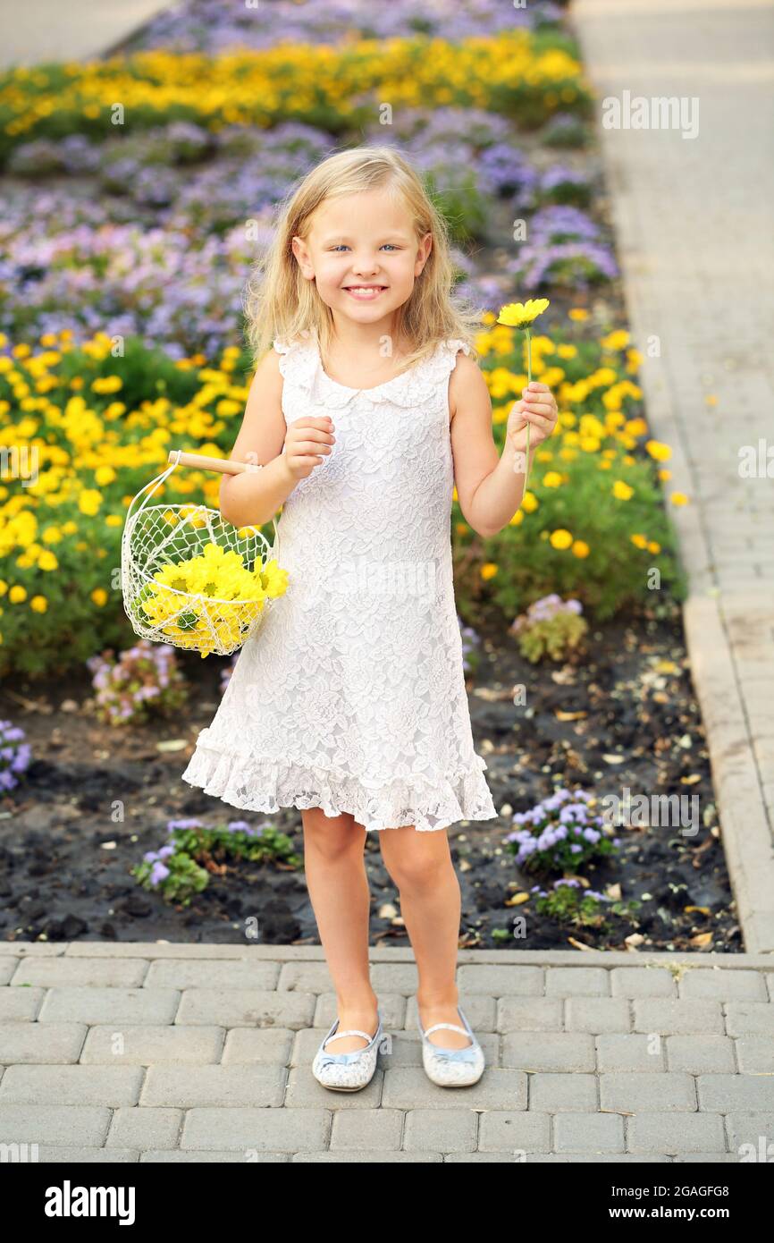 Happy girl walking in park Stock Photo - Alamy