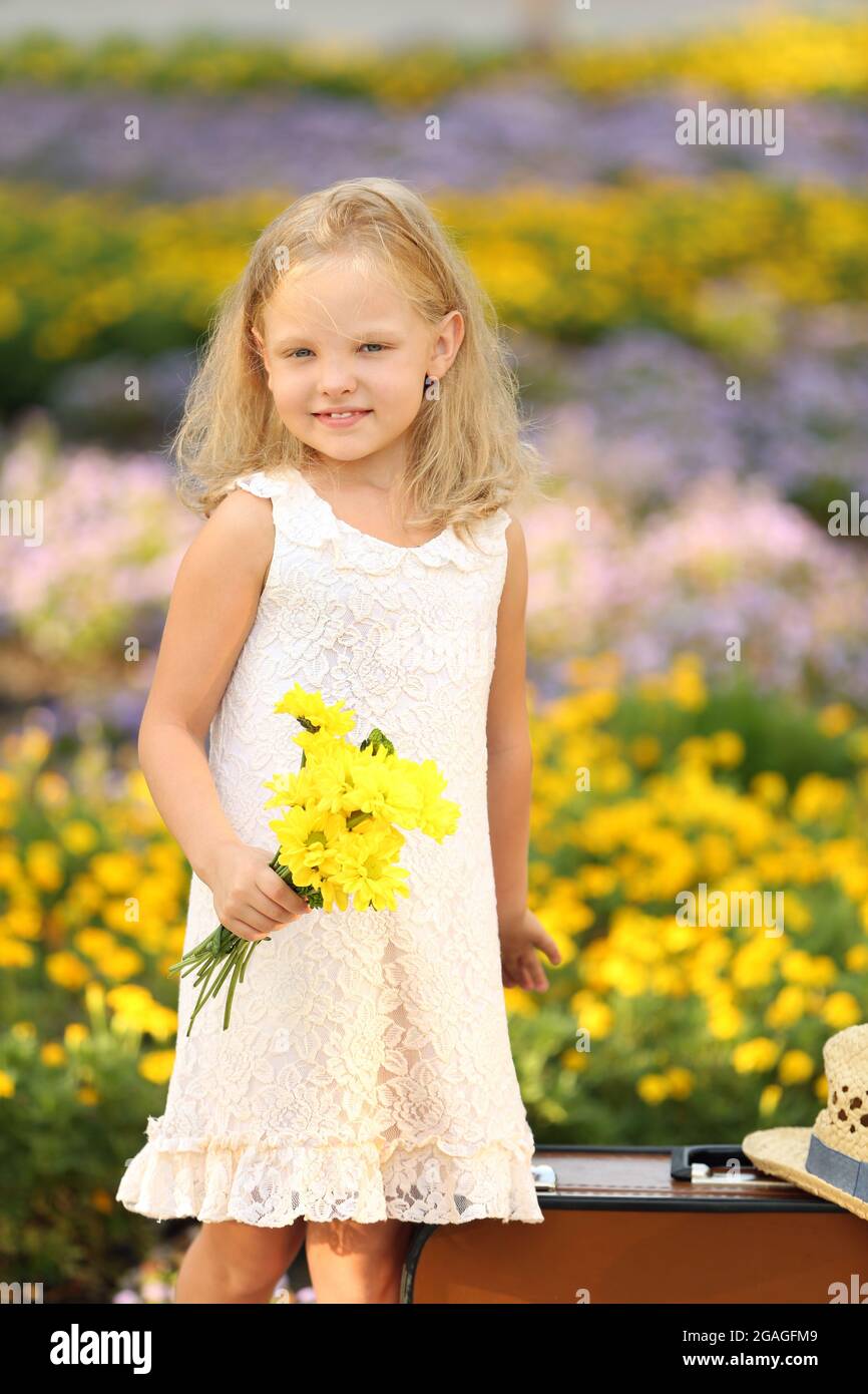 Happy girl walking in park Stock Photo - Alamy