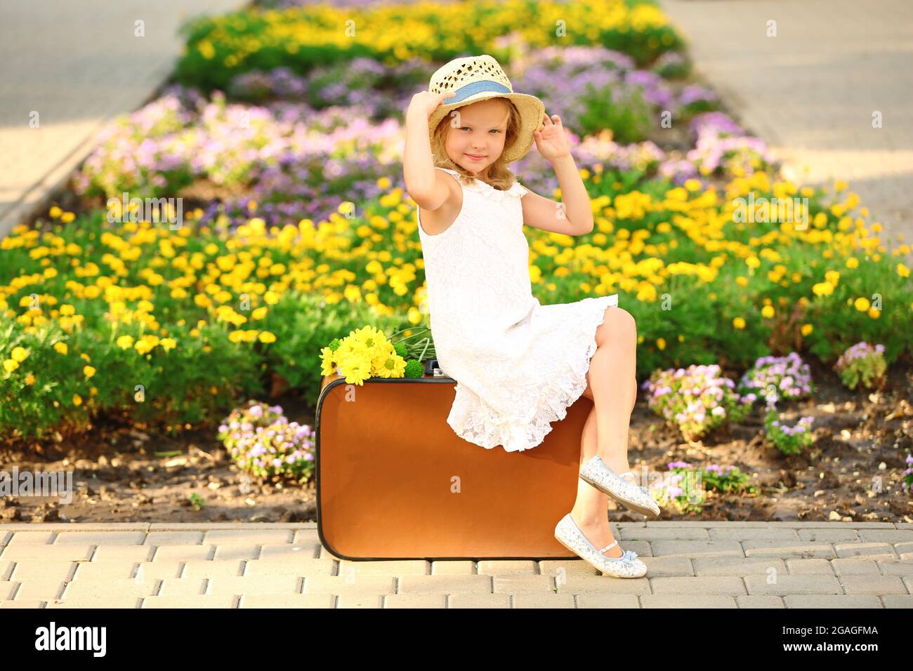 Happy girl walking in park Stock Photo - Alamy
