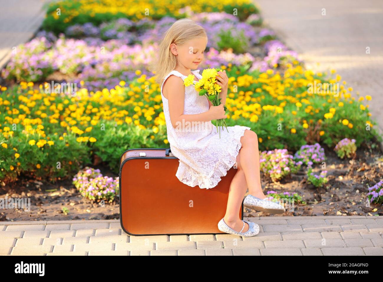 Happy girl walking in park Stock Photo - Alamy