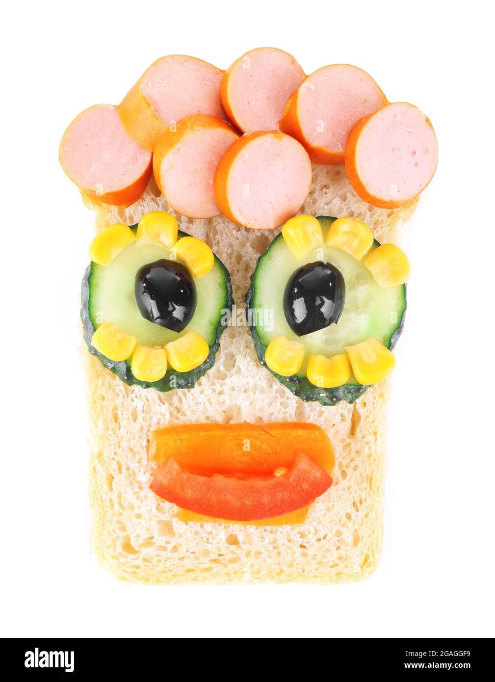 Creative sandwich for a child with funny face isolated on white ...