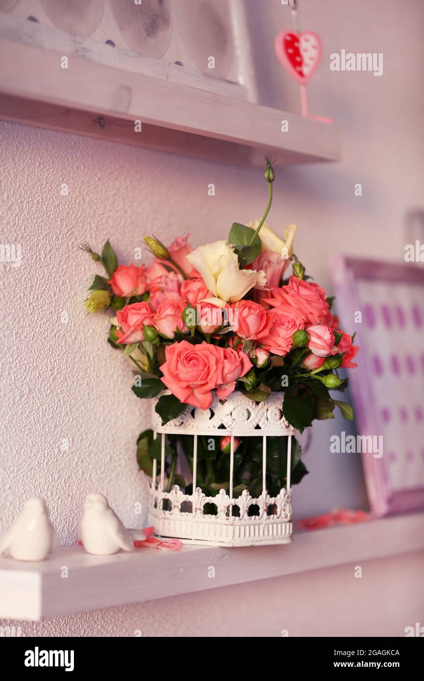 Beautiful rose in vase on shelf Stock Photo - Alamy