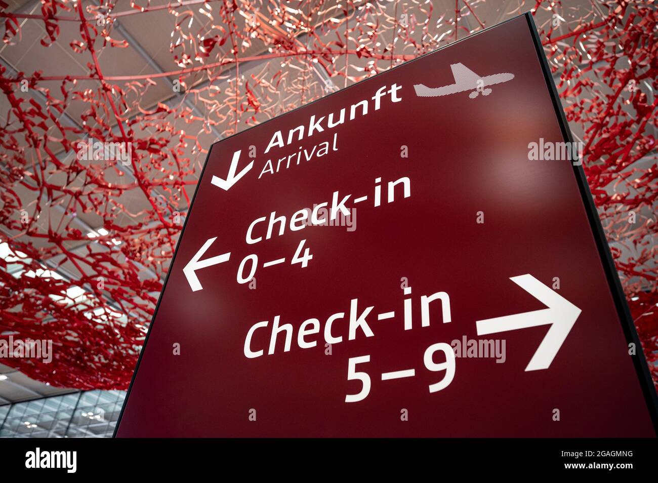 30 July 2021, Berlin, Schönefeld: A sign in the main hall of Berlin ...