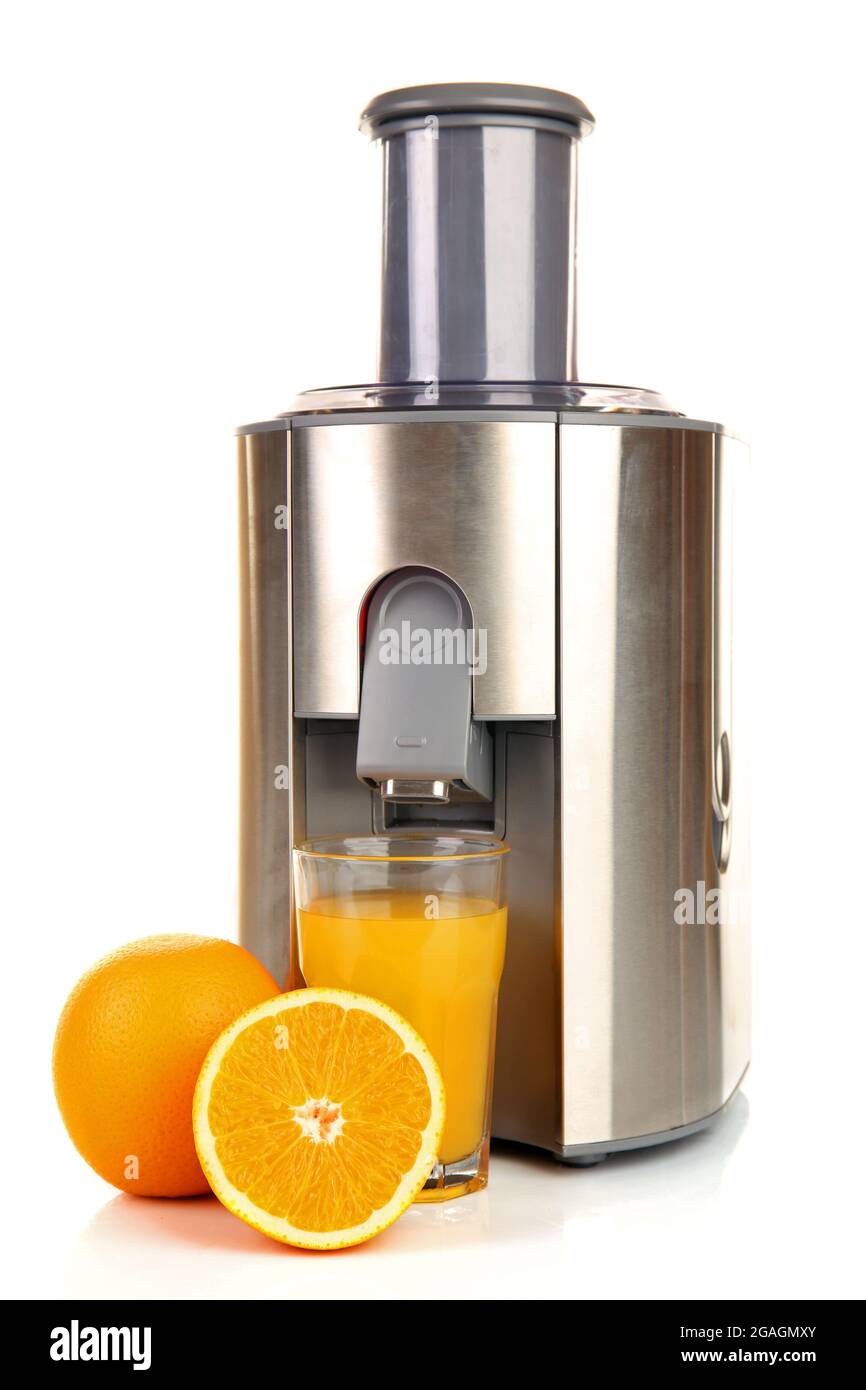Stainless juice extractor with glass of orange juice isolated on white ...