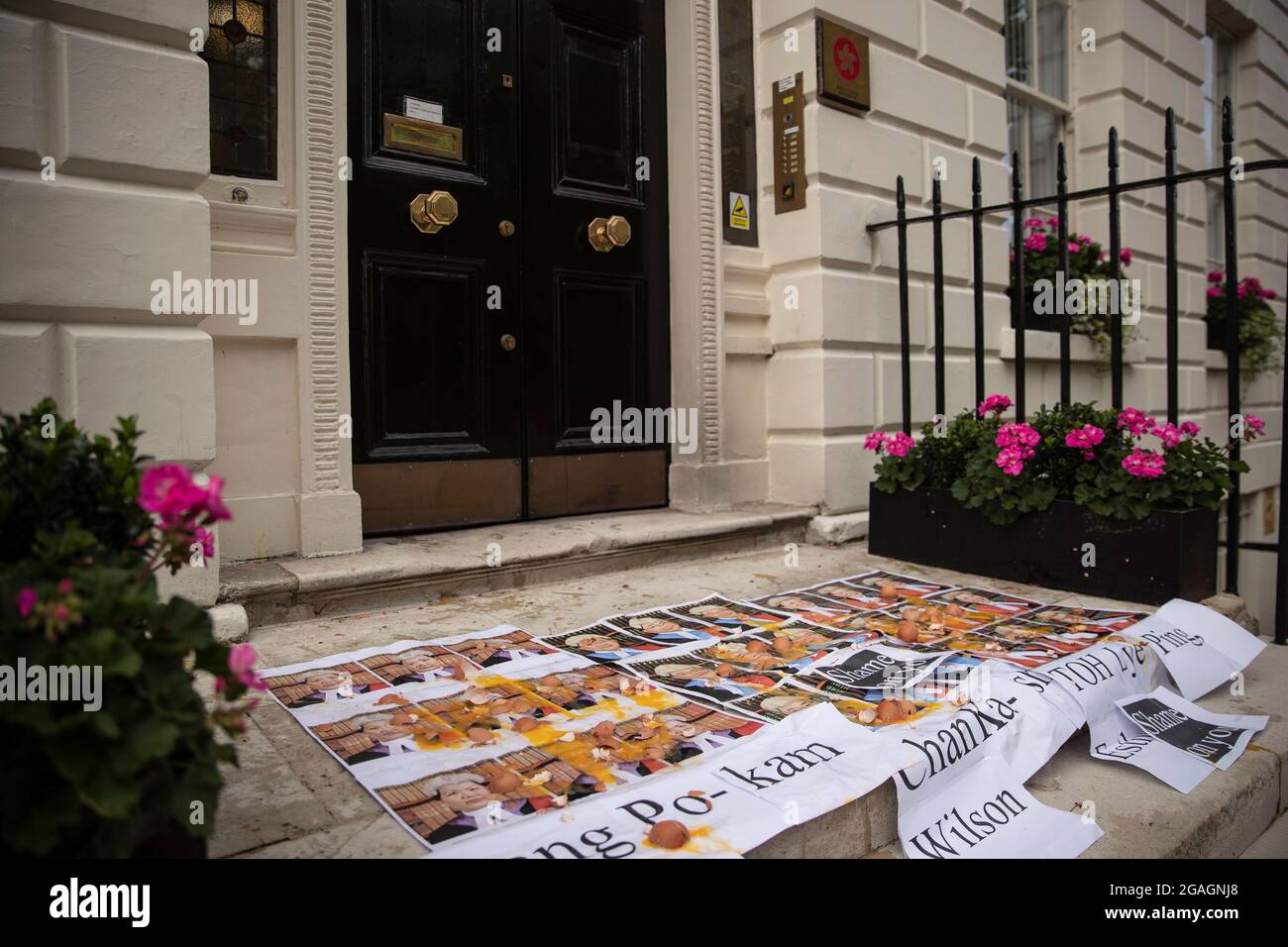 Broken eggs are seen on the self-printed portraits of three justices ...