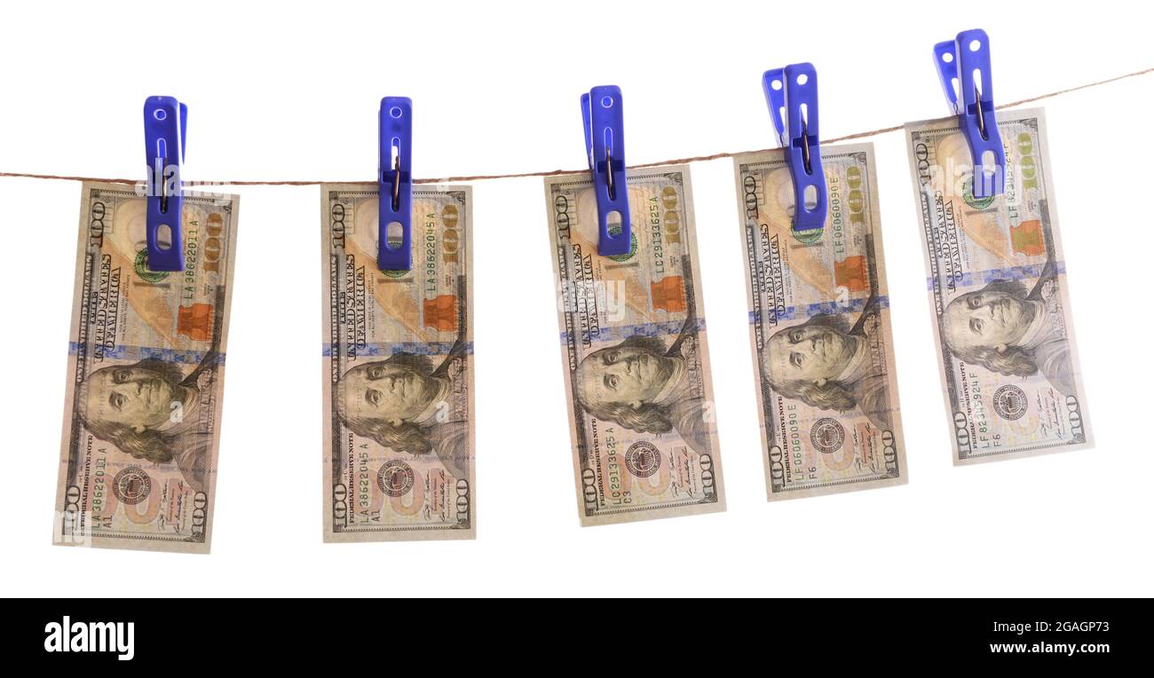 Concept of money laundering - dollars are drying on cord isolated on ...