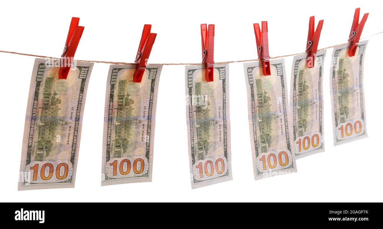 Concept of money laundering - dollars are drying on cord isolated on ...
