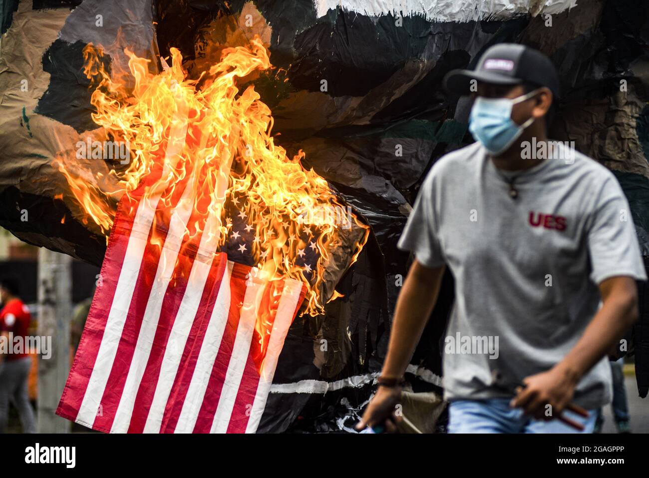 San Salvador, El Salvador. 30th July, 2021. A demonstrator runs as the ...