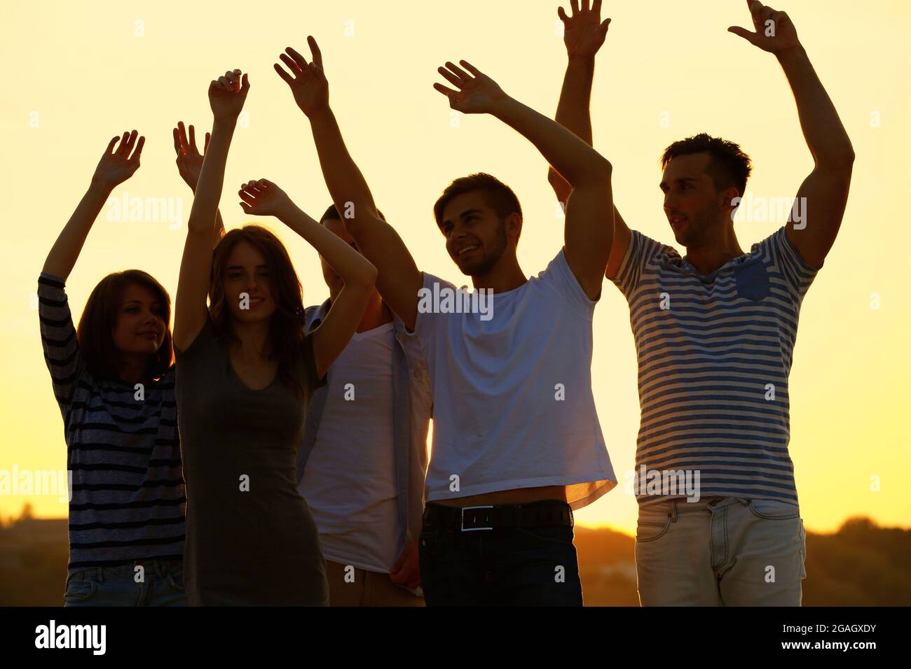 Young people on the riverside Stock Photo - Alamy