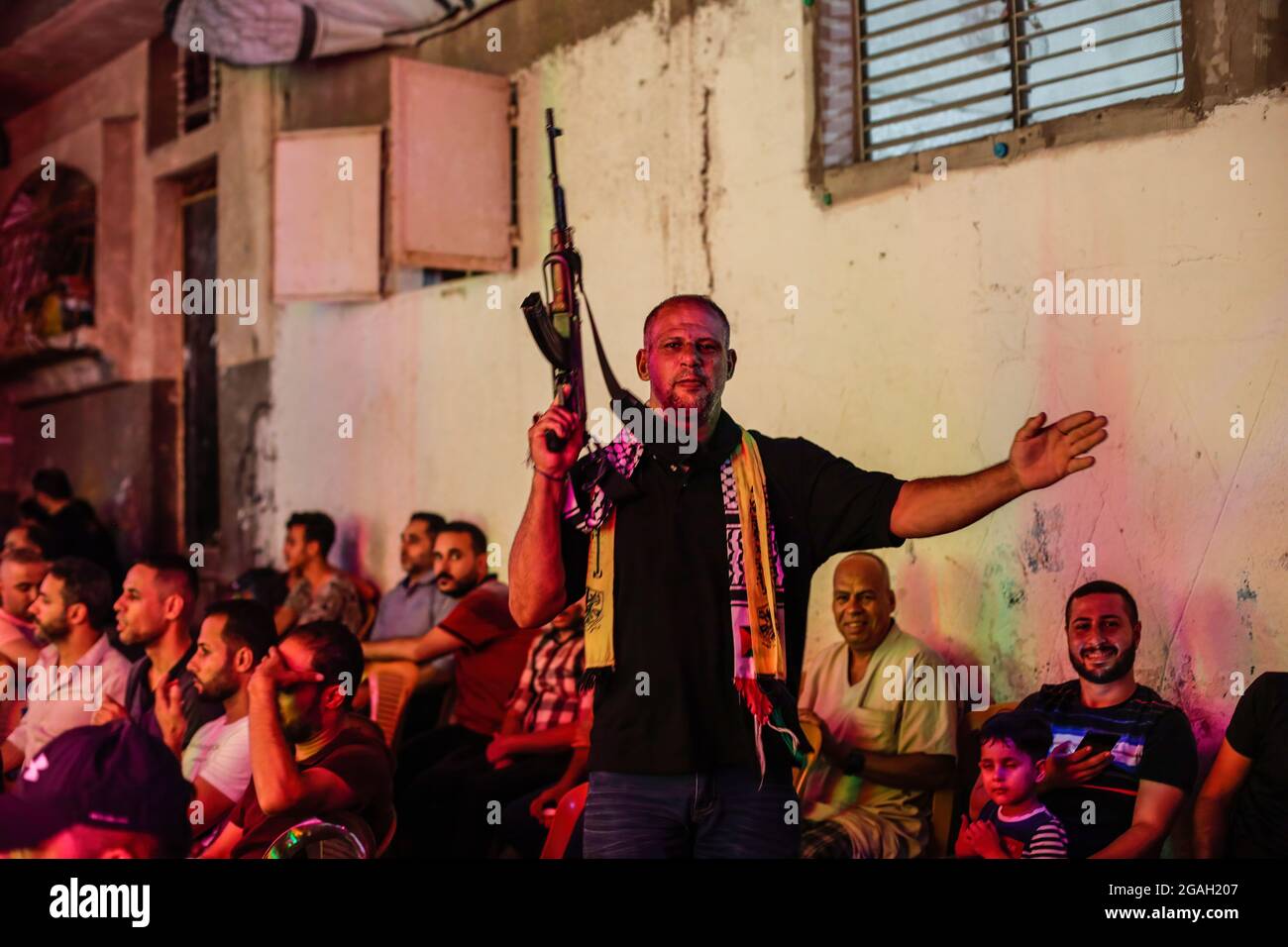 A man seen dancing with a gun at the wedding ceremony of a Palestinian ...