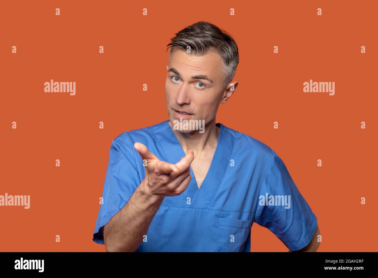 Friendly man asking question with gesture Stock Photo - Alamy