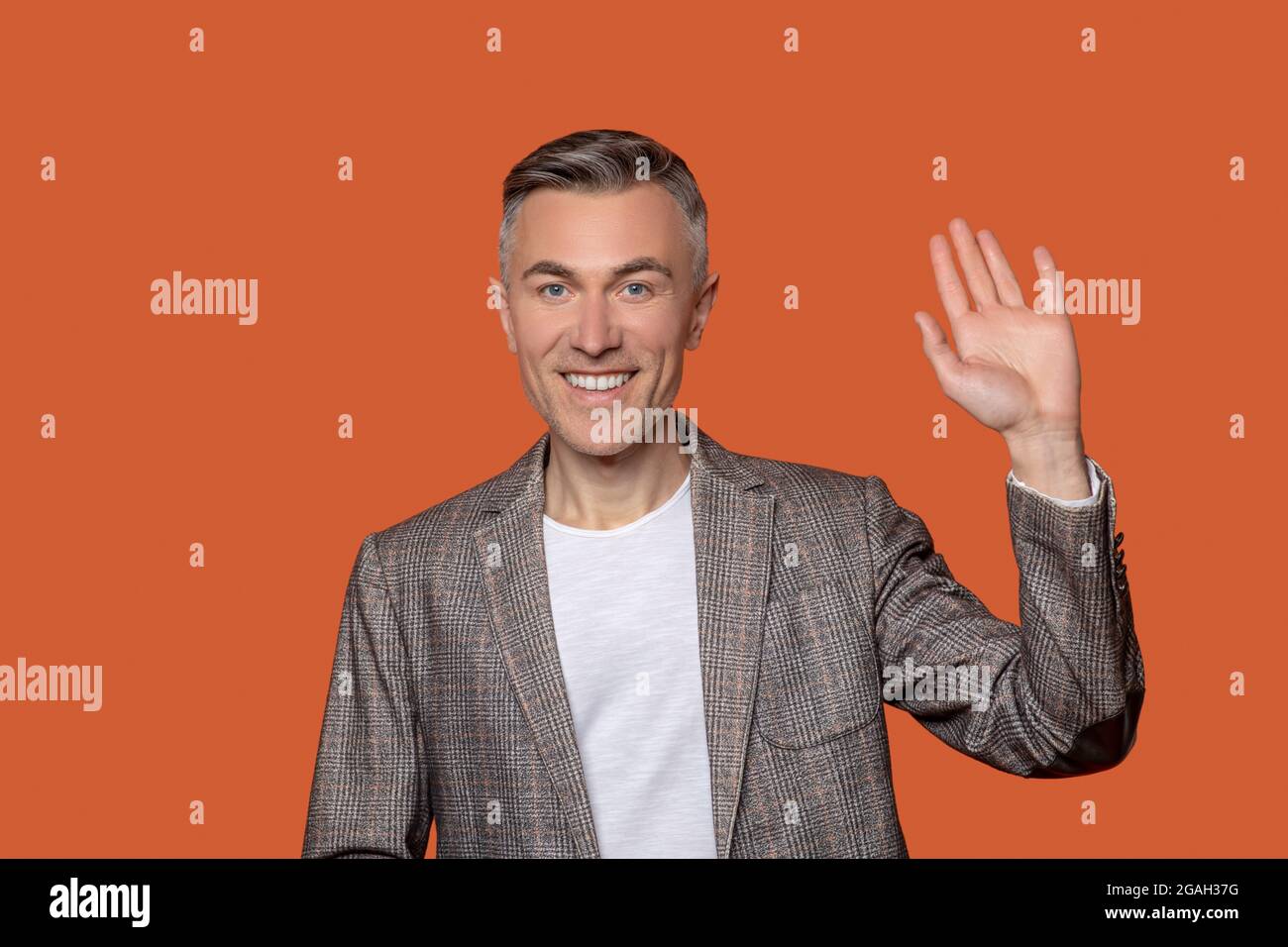 Hand raised and adult hi-res stock photography and images - Alamy