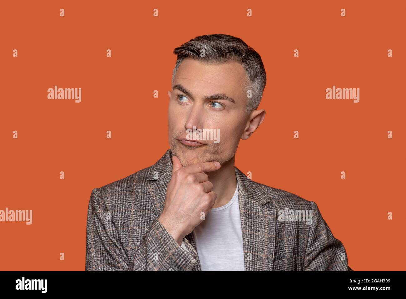 Touching chin hi-res stock photography and images - Alamy