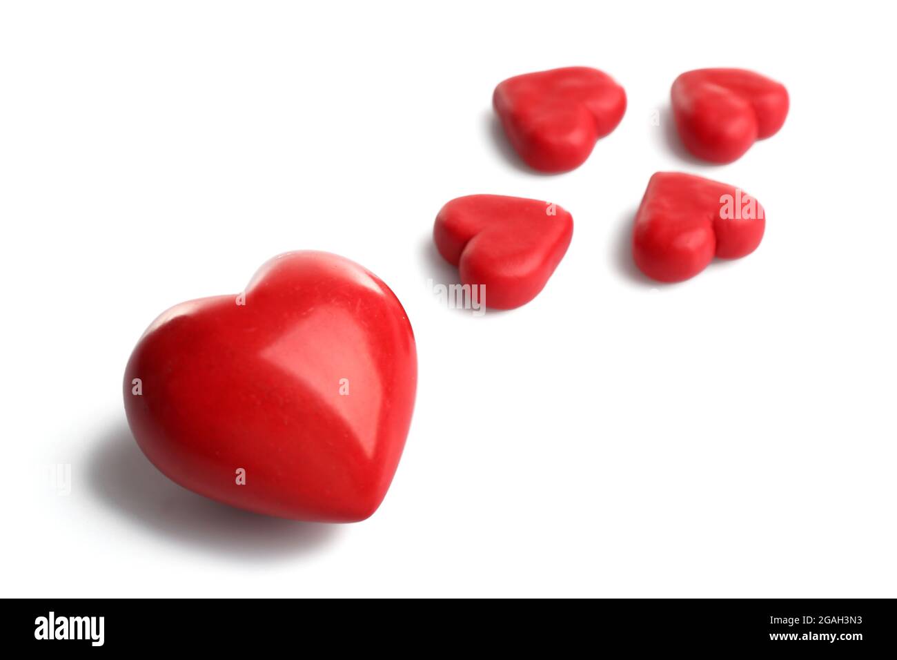 Five red hearts, isolated on white Stock Photo - Alamy