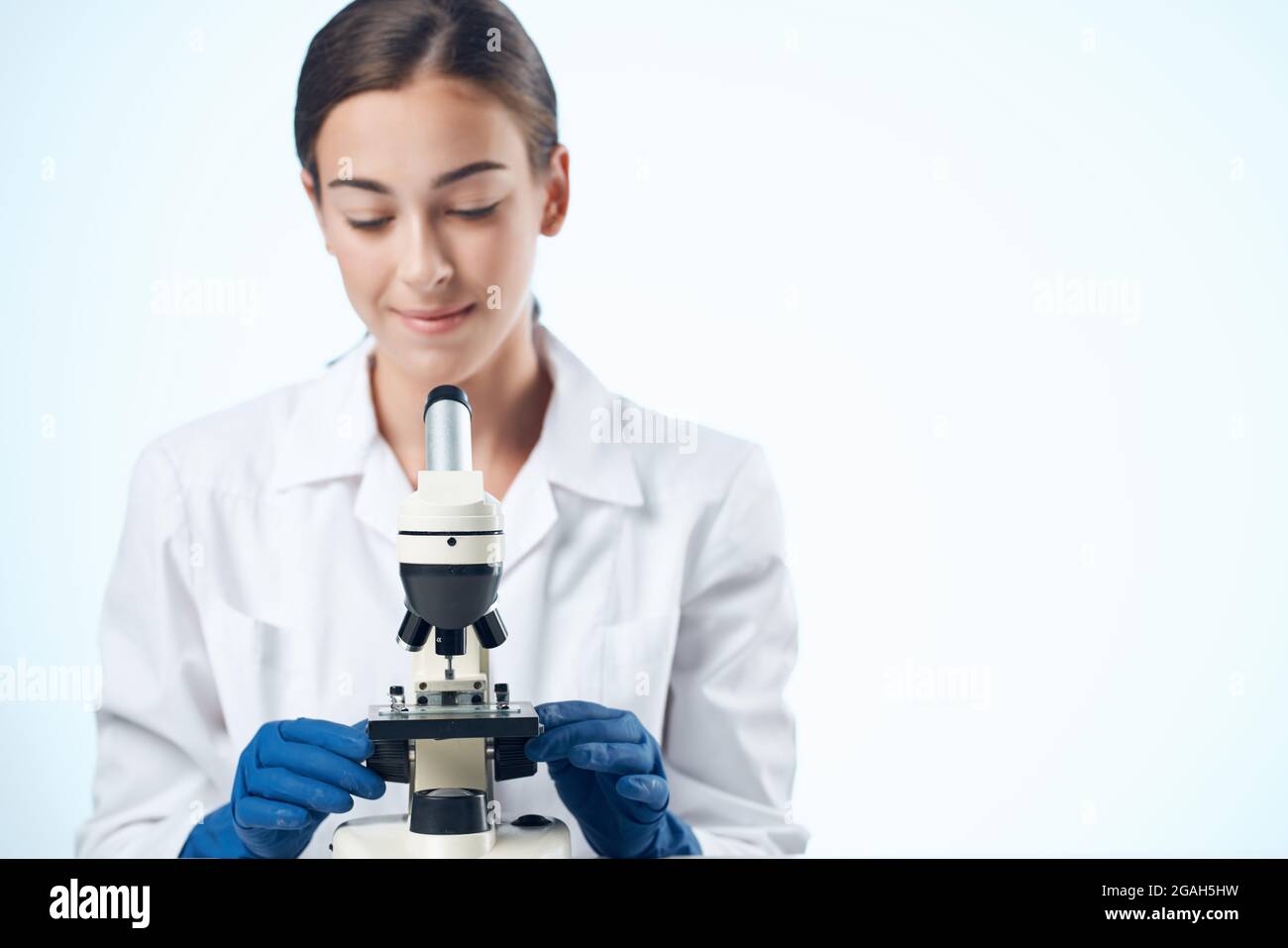 female doctor laboratory microscope diagnostics research microbiology ...