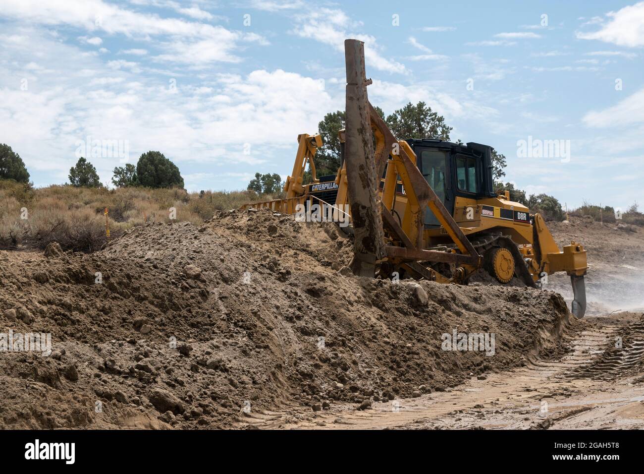 Excavators and bulldozers work on this road project on Sherwin Grade in ...