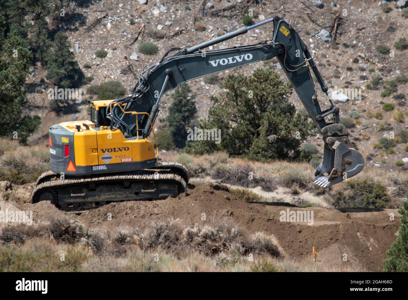 Excavators and bulldozers work on this road project on Sherwin Grade in ...