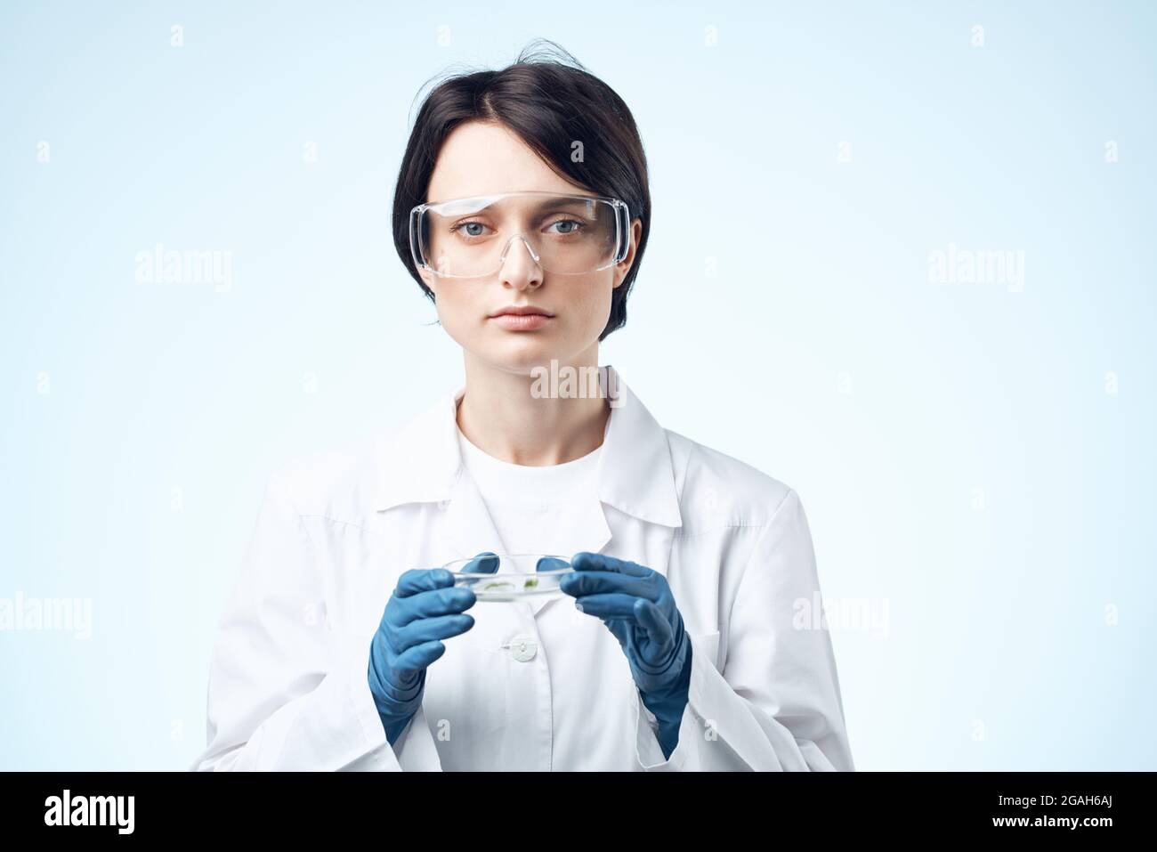 Woman in white coat biology laboratory research science Stock Photo - Alamy