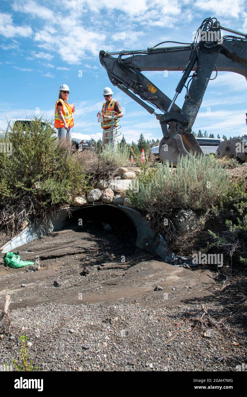 These excavators sit on the side of a highway on Sherwin Grade in Mono ...