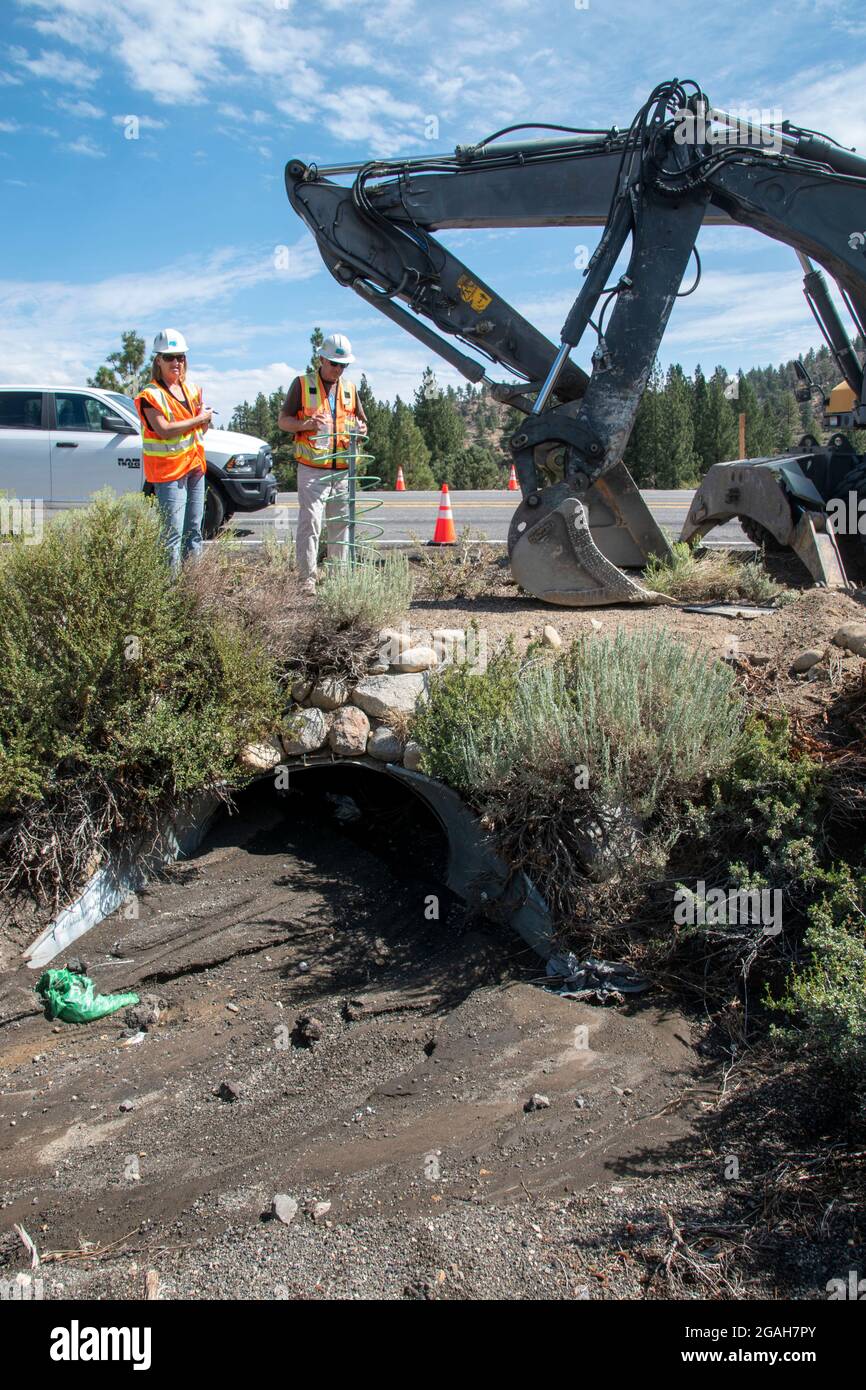These excavators sit on the side of a highway on Sherwin Grade in Mono ...