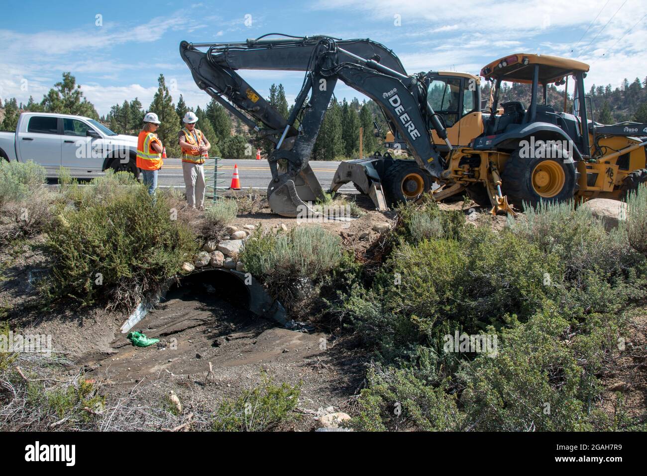 These excavators sit on the side of a highway on Sherwin Grade in Mono ...