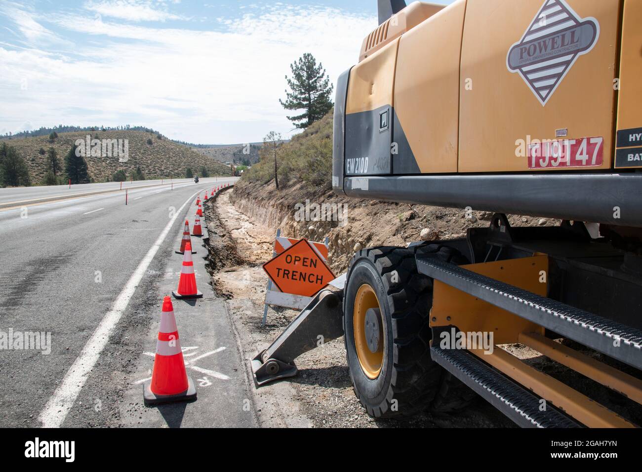 These excavators sit on the side of a highway on Sherwin Grade in Mono ...