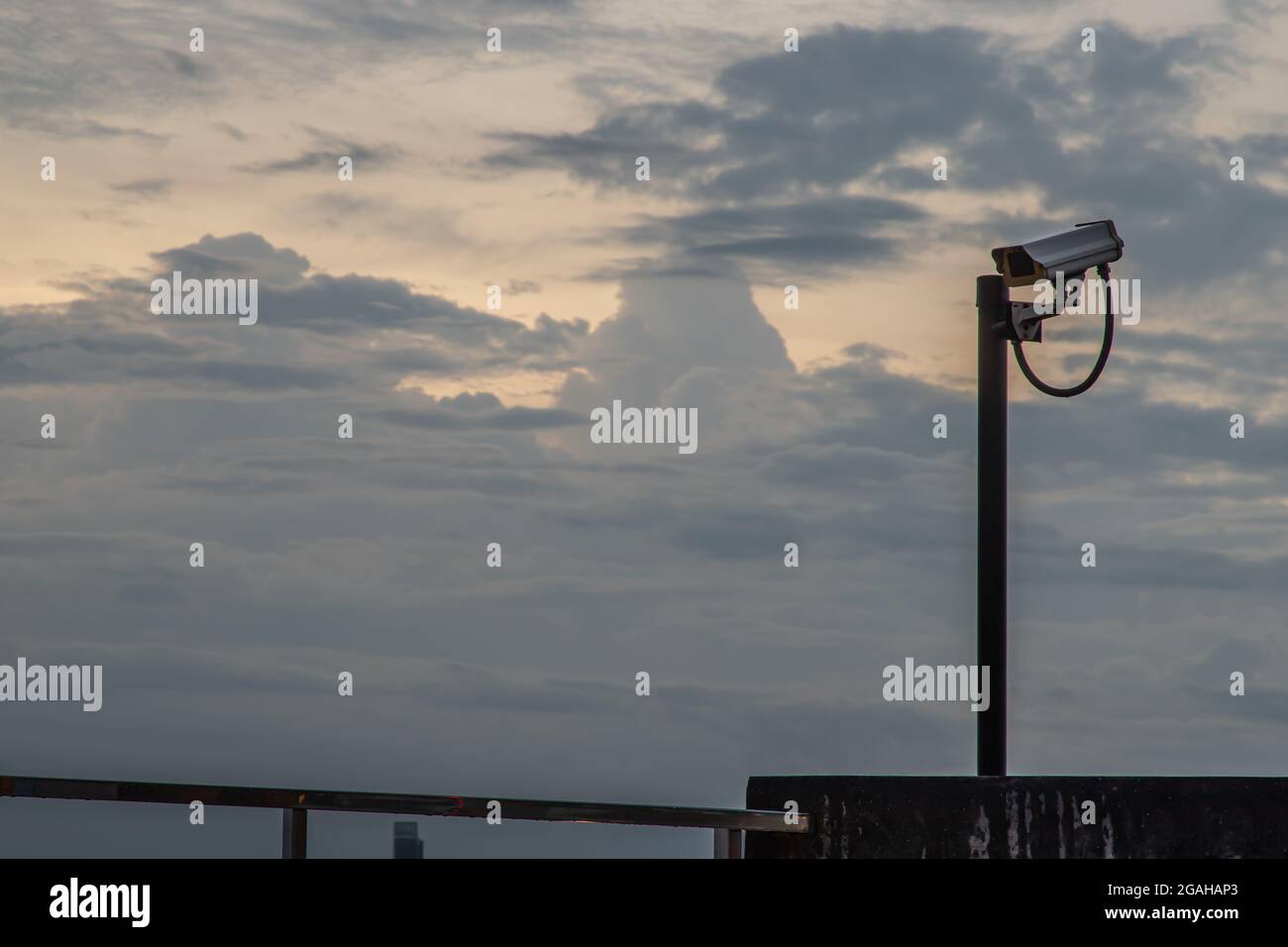 Modern surveillance camera on the sky background. the concept of ...