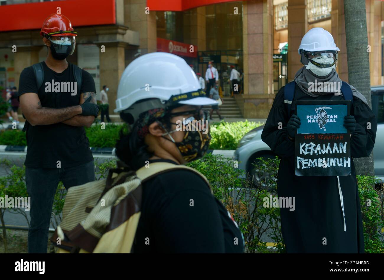 Kuala Lumpur, Kuala Lumpur, Malaysia. 31st July, 2021. Protester hold ...