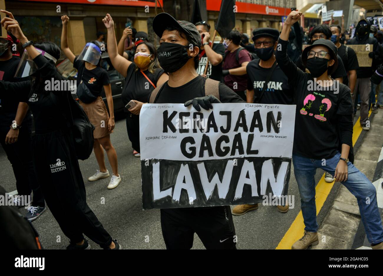 Kuala Lumpur, Malaysia. 31st July, 2021. Protester hold the placard ...
