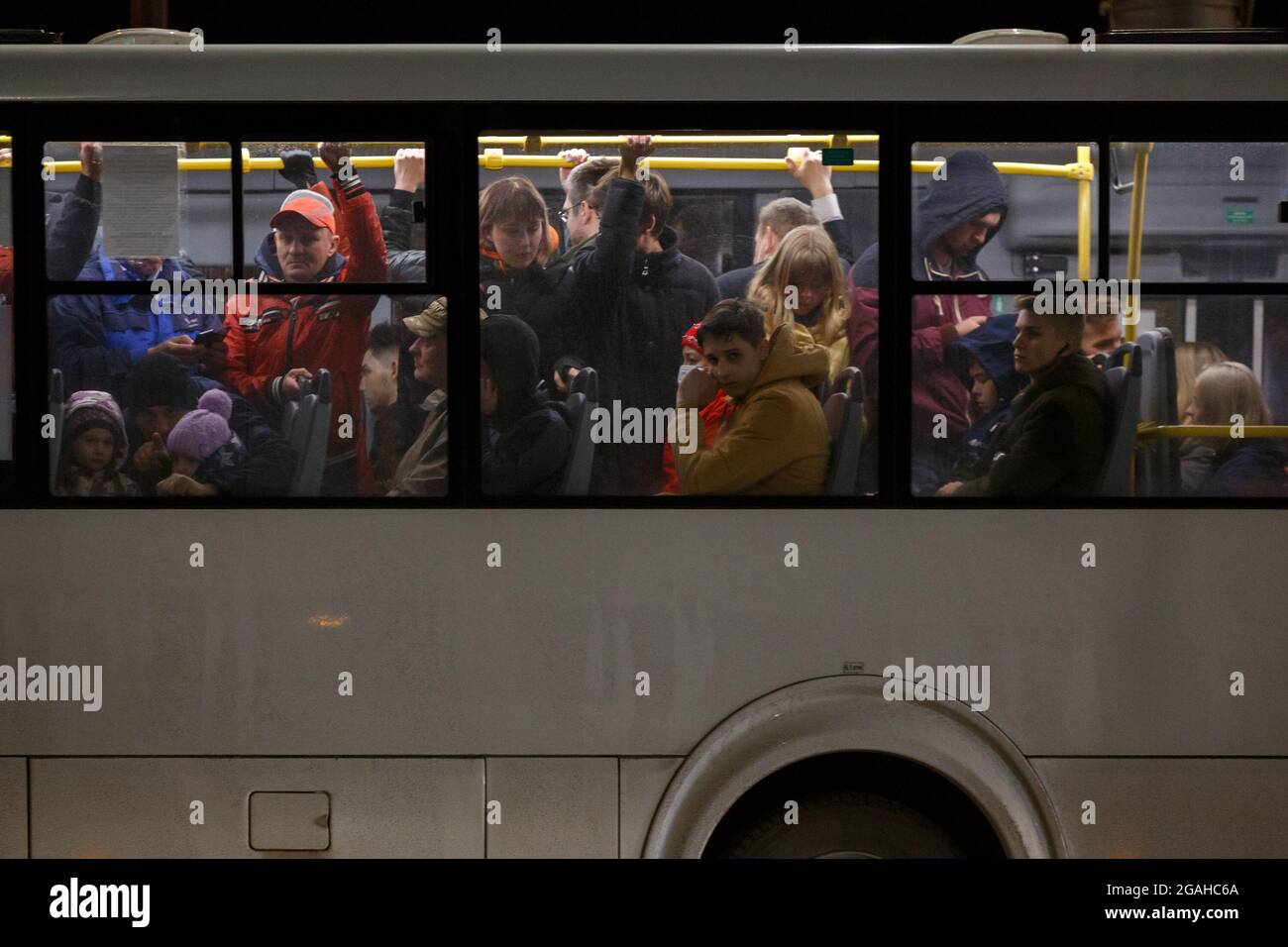 People in crowded public transit bus hi-res stock photography and ...