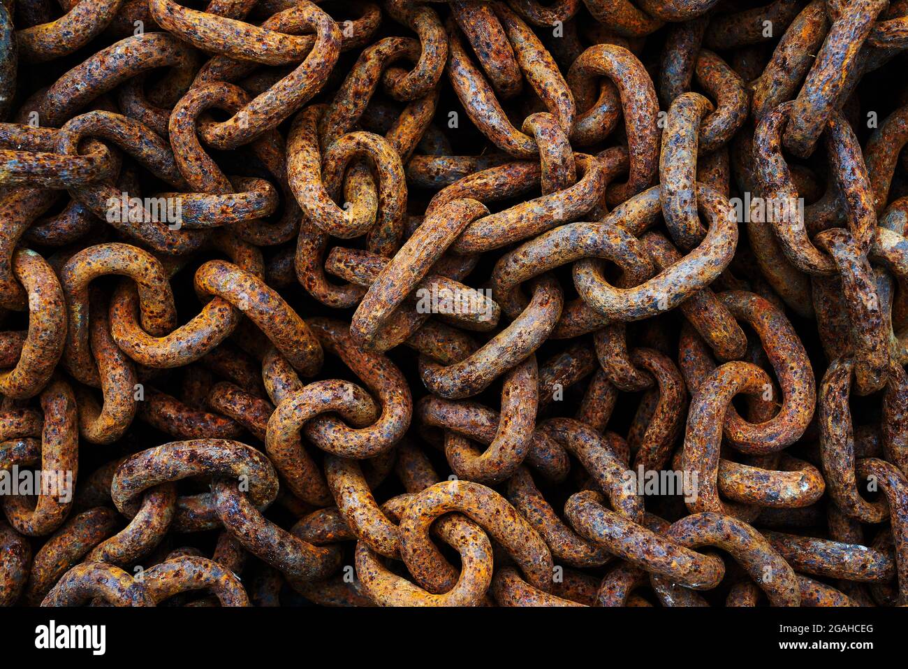 Overhead shot of rusty metal chains in a bunch Stock Photo - Alamy