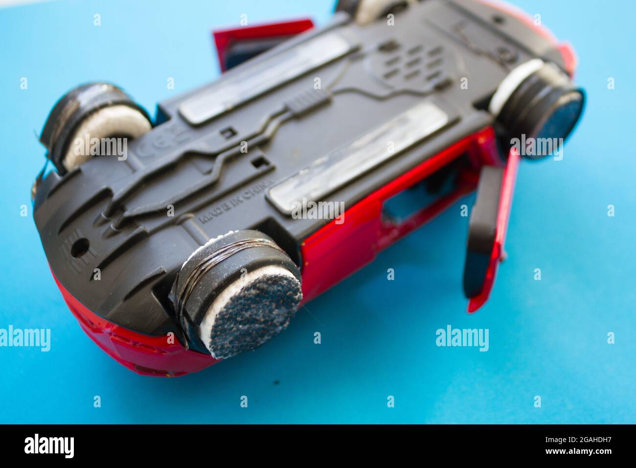 Toy car turned overhead. Car accident concept Stock Photo - Alamy