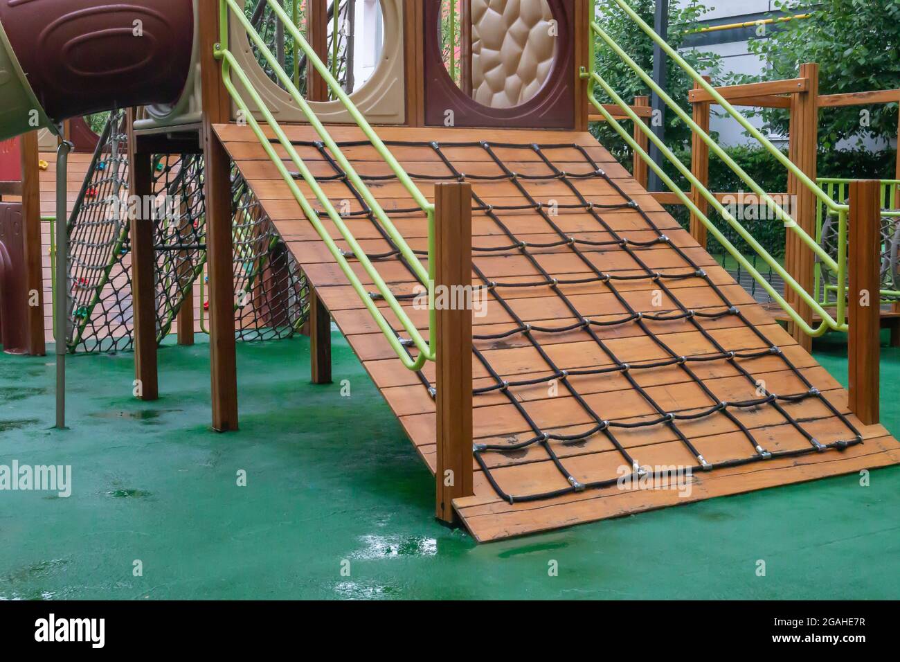 A courtyard of high-rise buildings with a modern and large playground ...