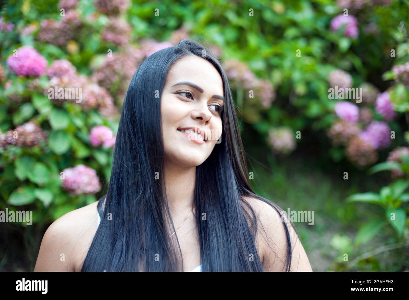 Portrait of smiling happy young latin american woman, isolated ...