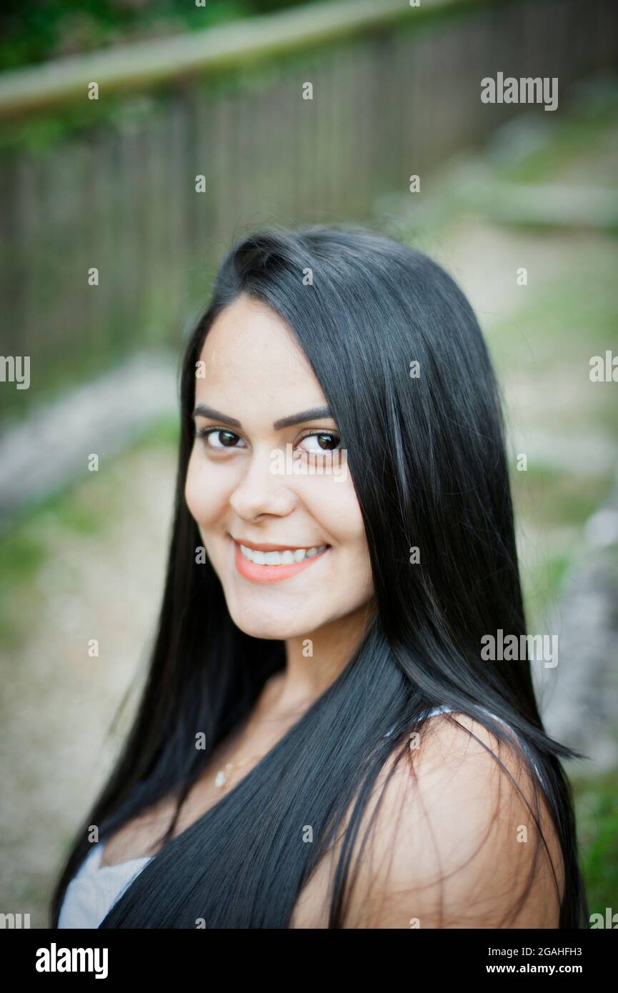 Portrait of smiling happy young latin american woman, isolated ...