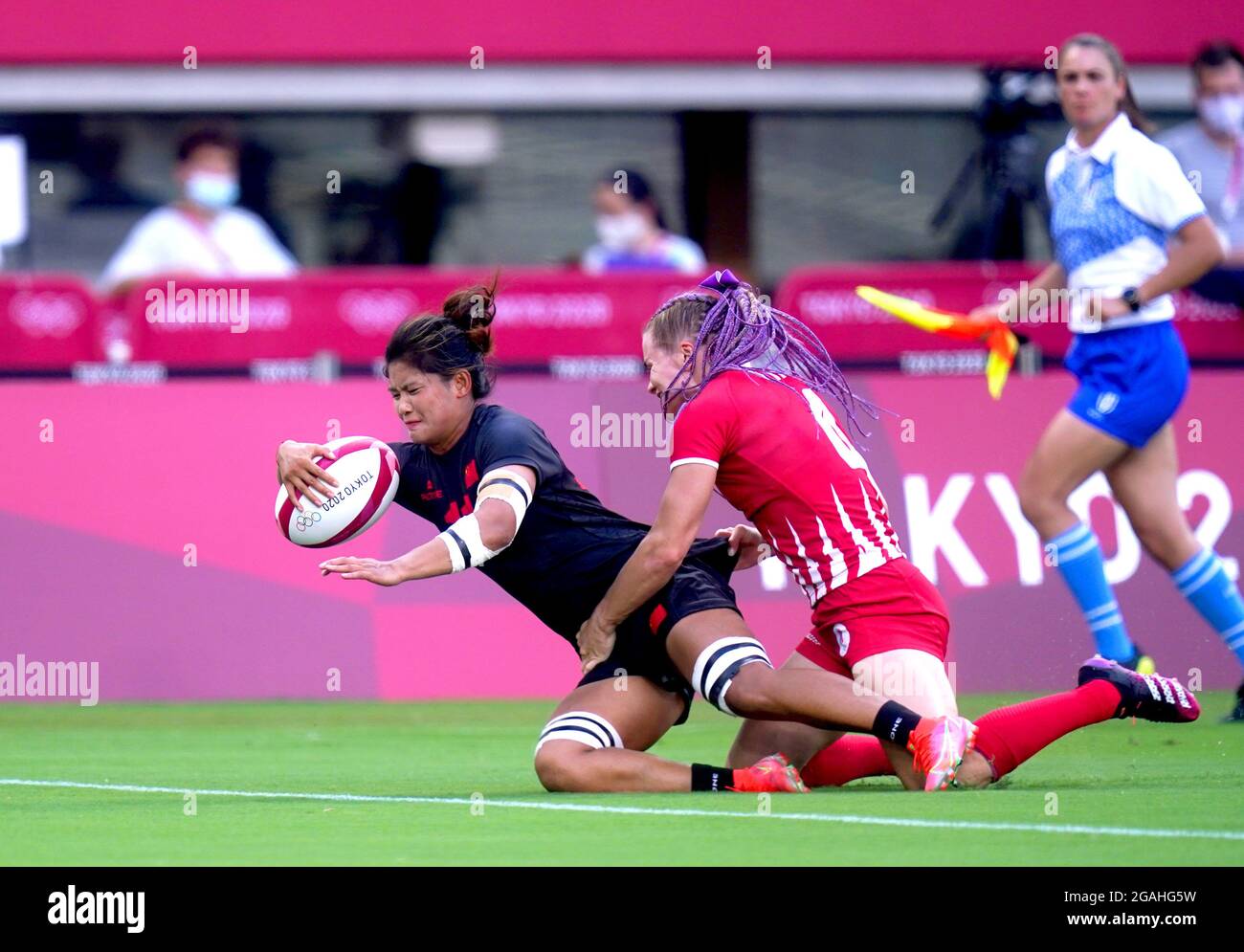 People Republic of China's Xiaoyan Xu scores a try during the Rugby ...