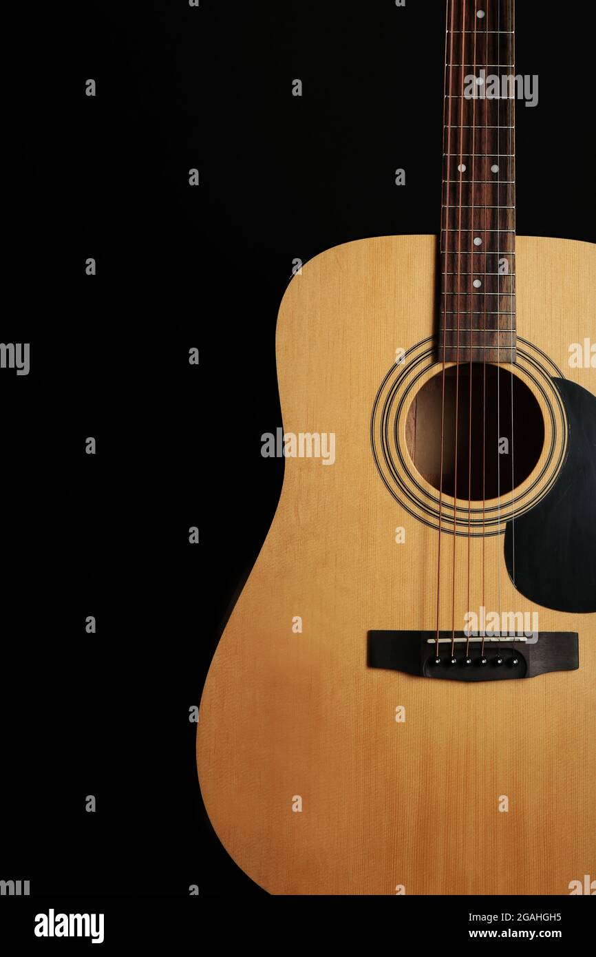 Guitar on black background Stock Photo - Alamy