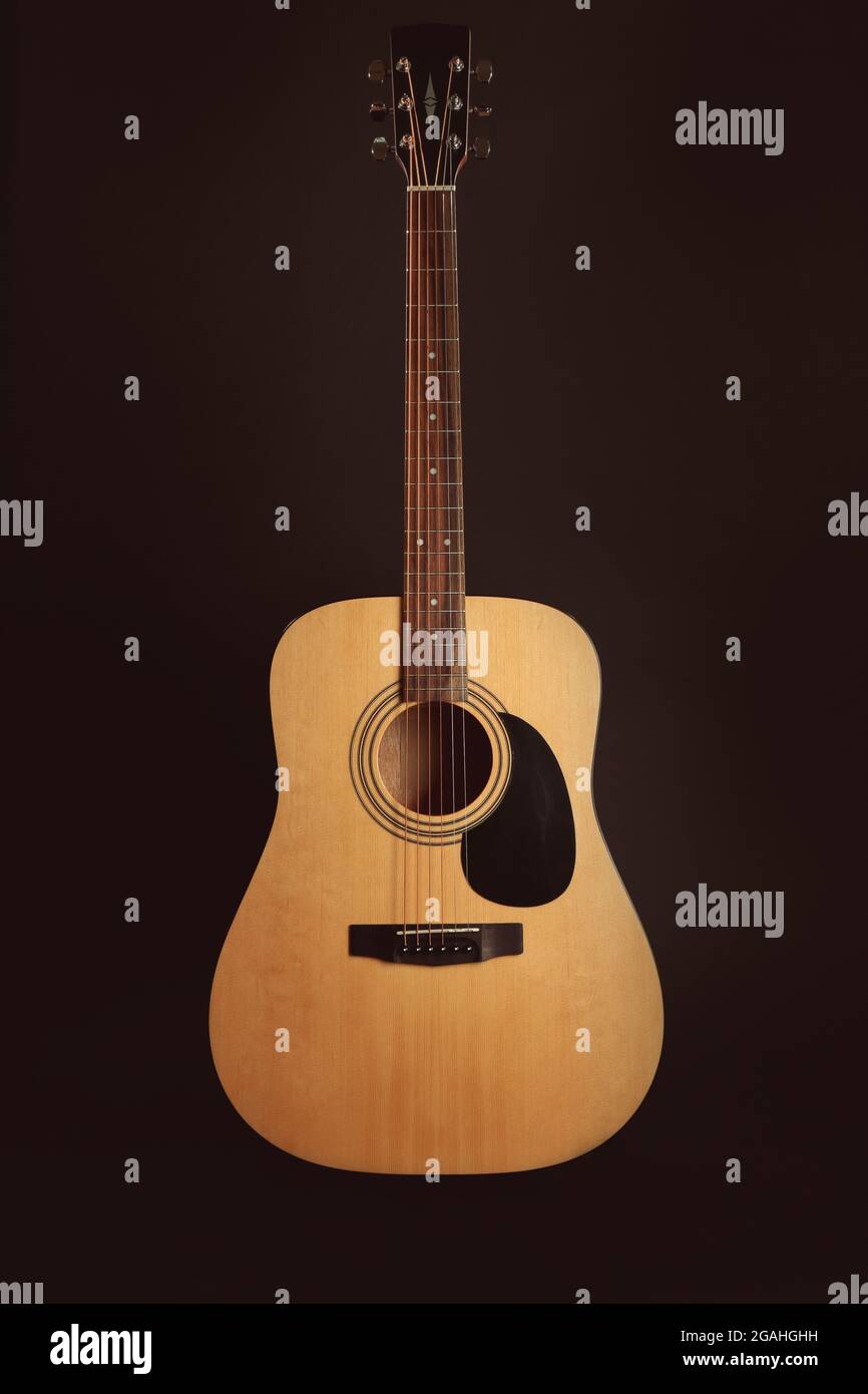 Guitar on black background Stock Photo - Alamy