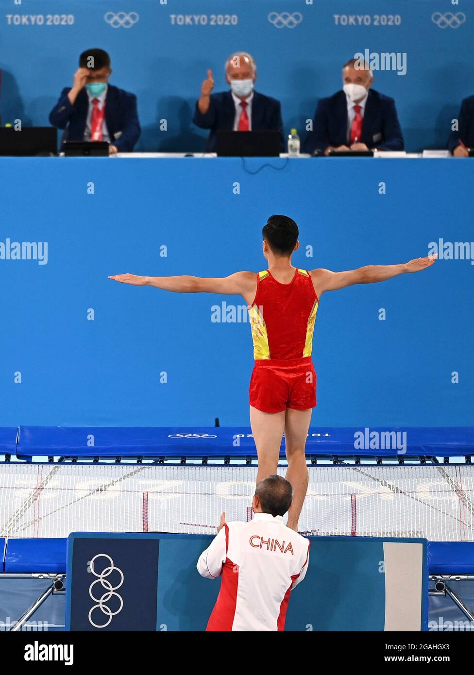Tokyo, Japan. 31st July, 2021. Dong Dong (middle) of China competes ...