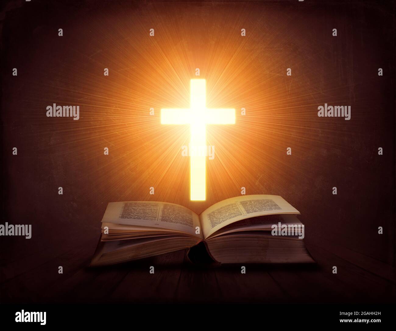 Open book with glowing cross above it; religion concept Stock Photo - Alamy