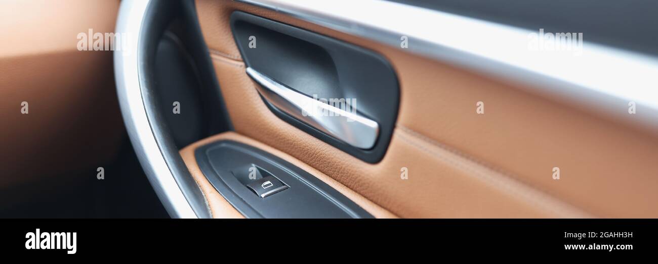 Car handle and window lifter button in luxury car Stock Photo - Alamy
