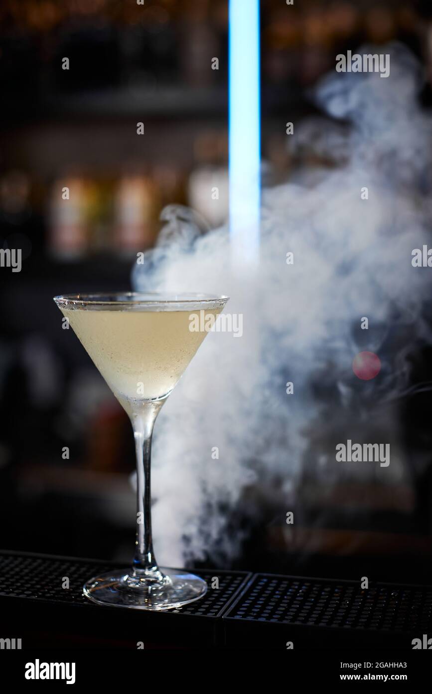 the exotic alcoholic cocktail with the smoke Stock Photo - Alamy