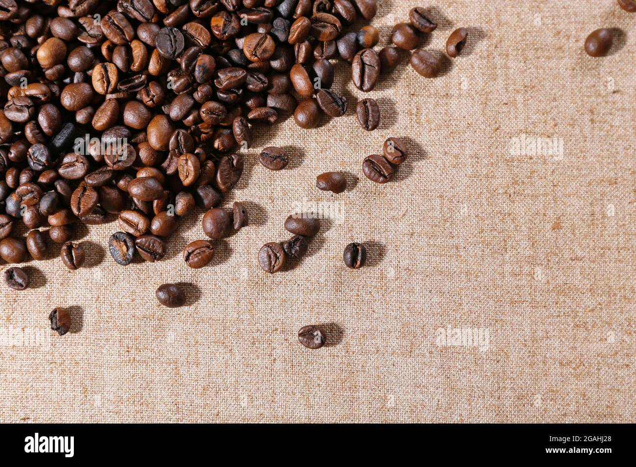 Roasted coffee beans on the linen fabric Stock Photo - Alamy