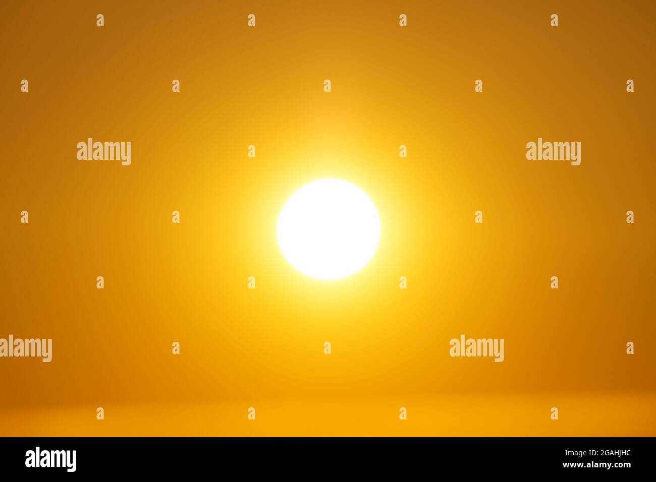 Golden colored blurred image of sun Stock Photo - Alamy