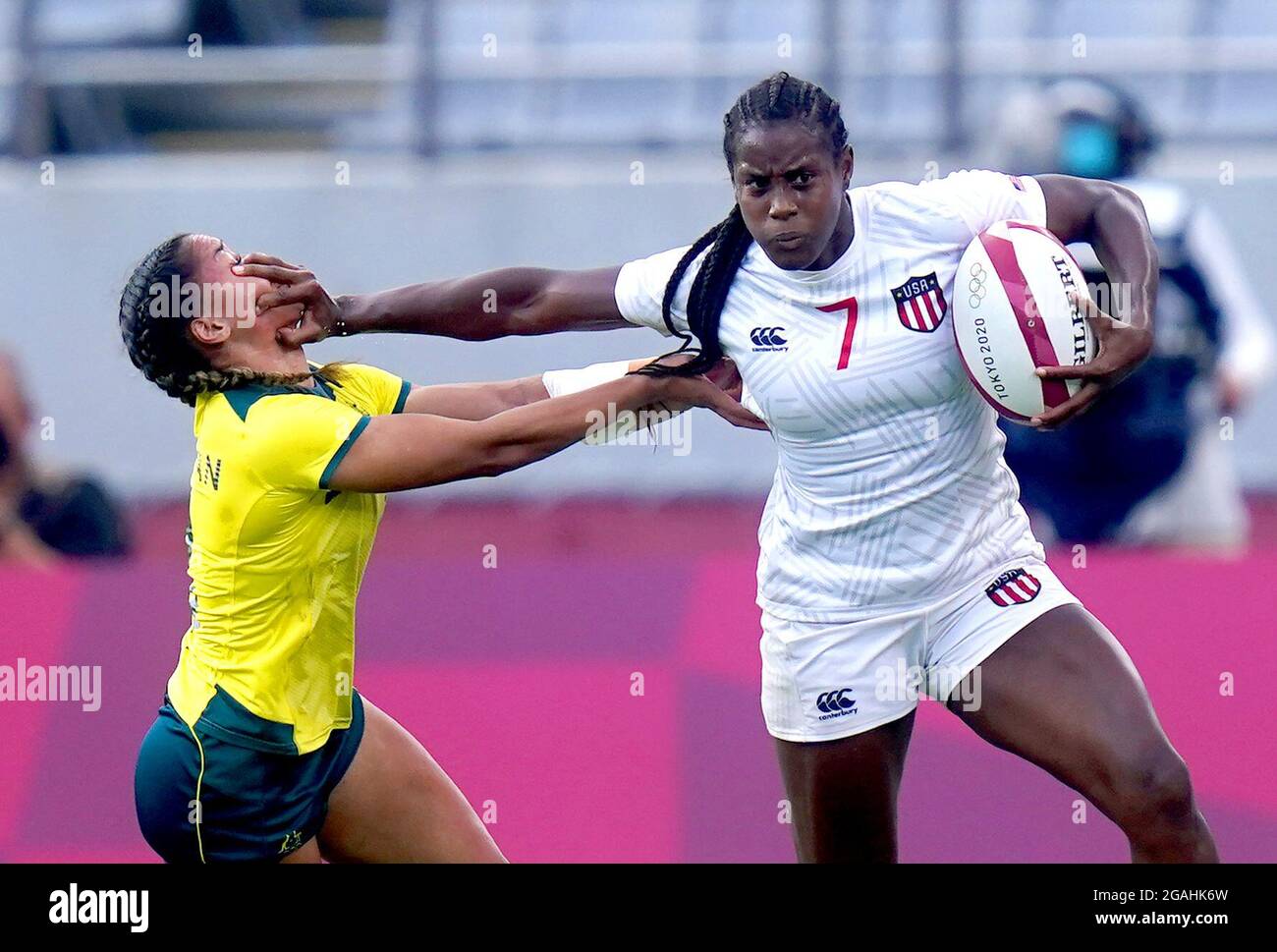 USA's Naya Tapper (right) evades being tackled by Australia's Faith ...
